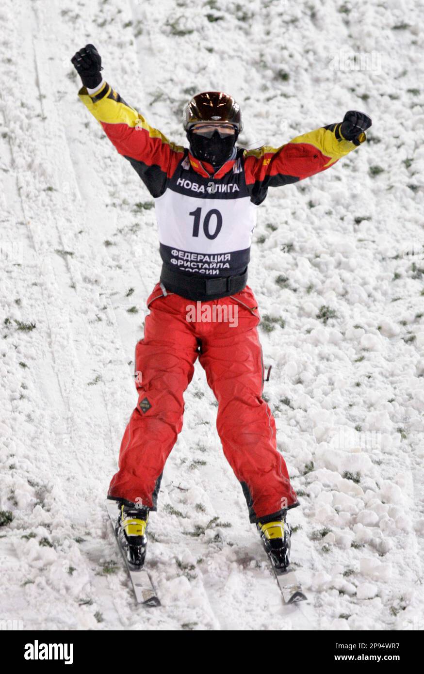 Winner of the aerials event Xu Mengtao of China, lands after performing ...