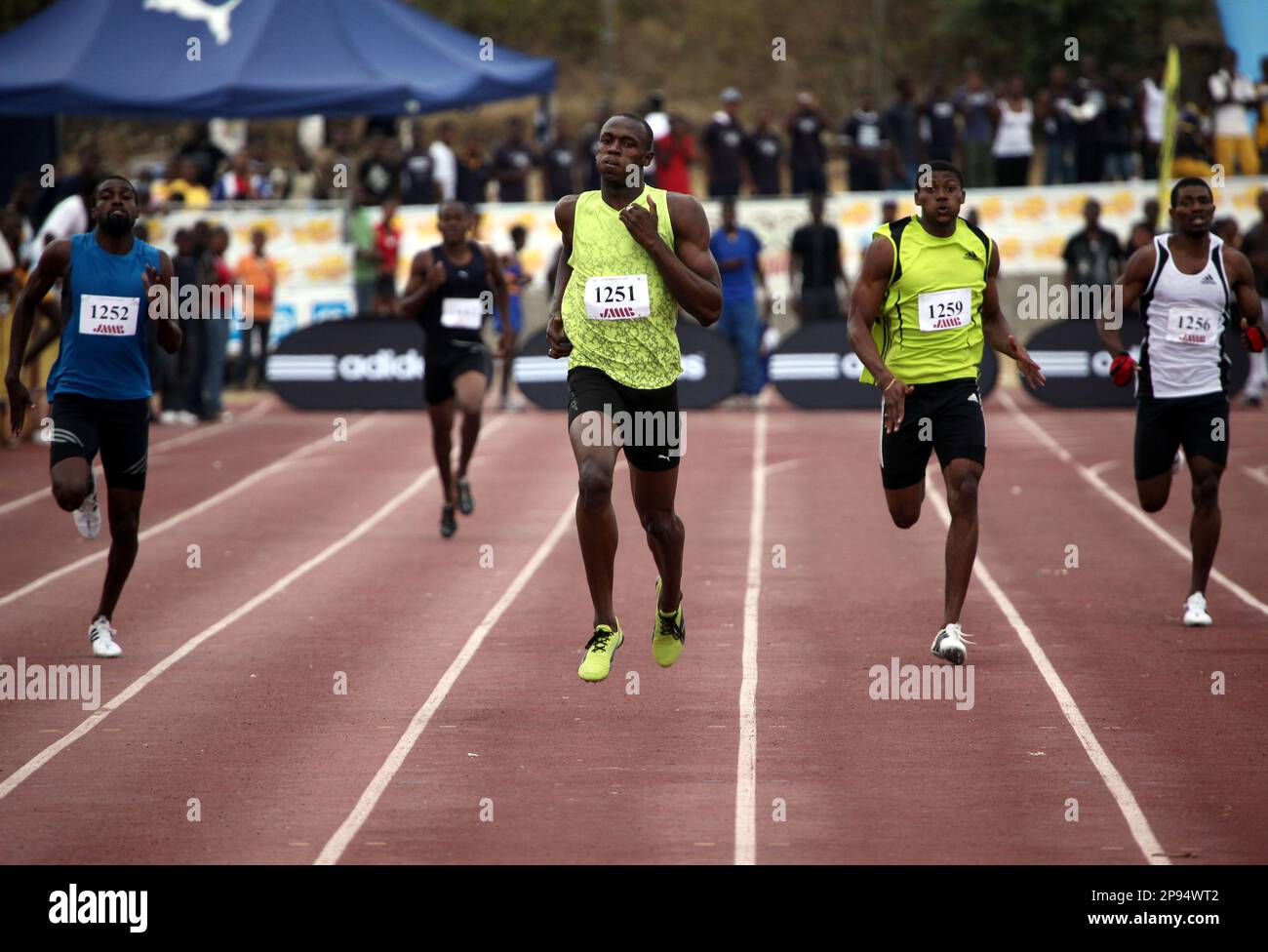 World Champion Jamaican sprinter Usain Bolt, center, runs the 400 ...