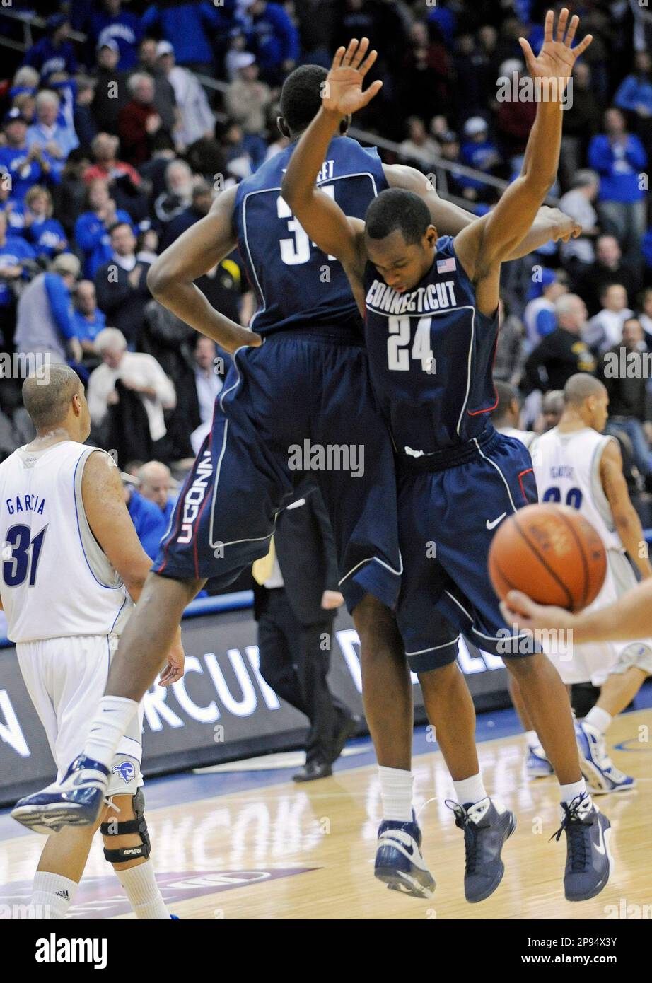 Connecticut's Craig Austrie (24) celebrates with Hasheem Thabeet after ...
