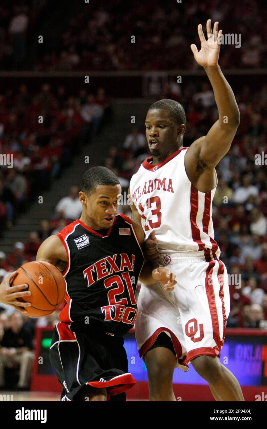 Texas Tech guard John Roberson, left, drives to the basket as Oklahoma ...
