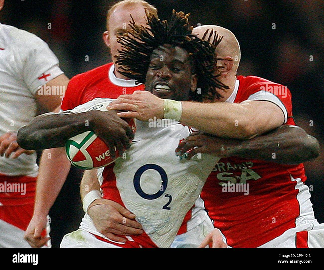 England's Paul Sackey is held by Tom Shanklin of Wales during the Six ...