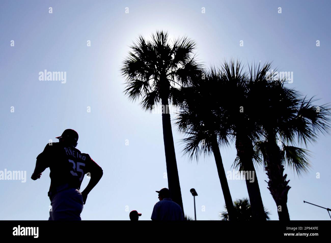 St. Louis Cardinals starting pitcher Joel Pineiro, lft, jogs out to the ...