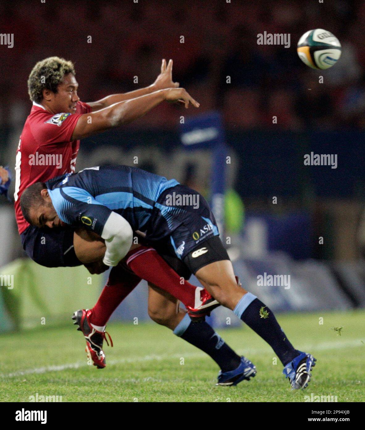 South Africa's Bulls Bryan Habana, right, tackles Australia's Reds ...