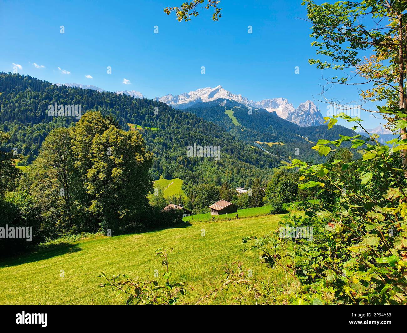 View over meadows to Alpspitze, Zugspitze and Waxenstein Stock Photo ...