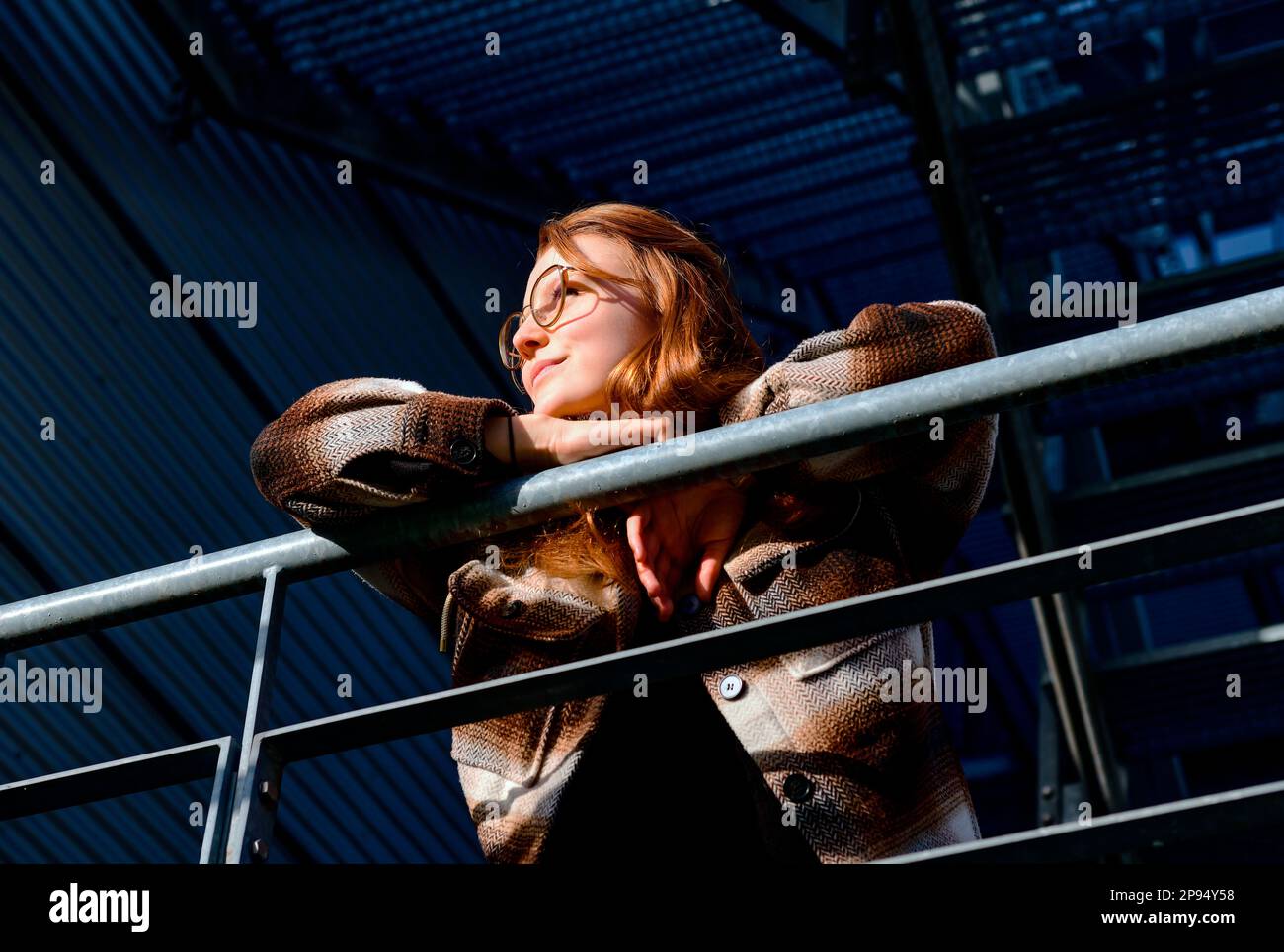 Woman in red shirt leans hi-res stock photography and images - Alamy
