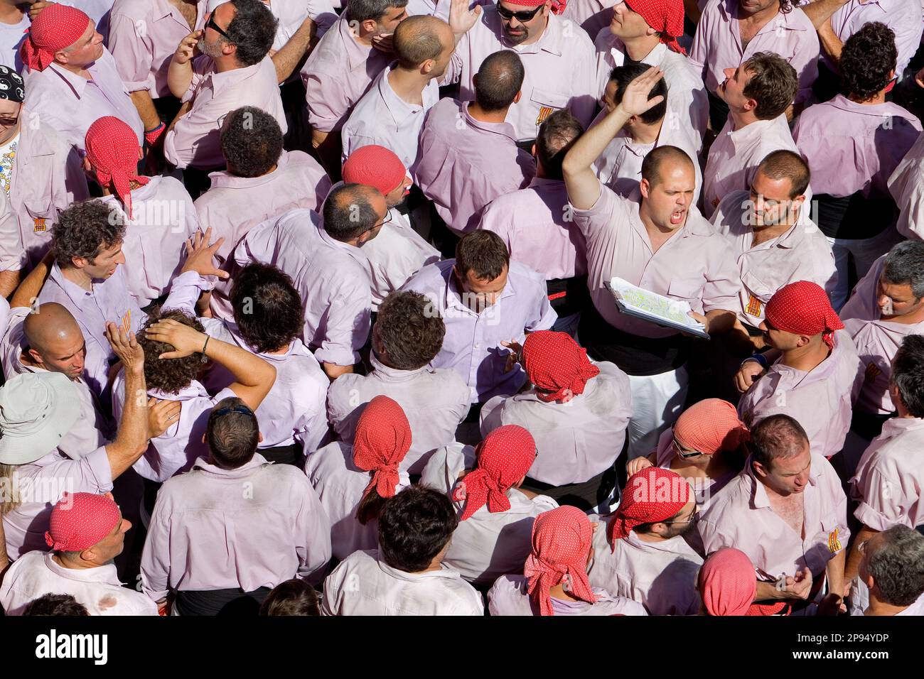 Man commanding the group. 'Castellers' building human tower, a Catalan ...