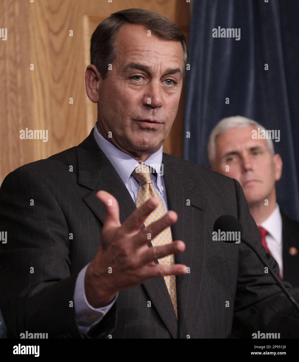 Rep, Mike Pence, R-Ind., looks on at right as House Minority Leader ...