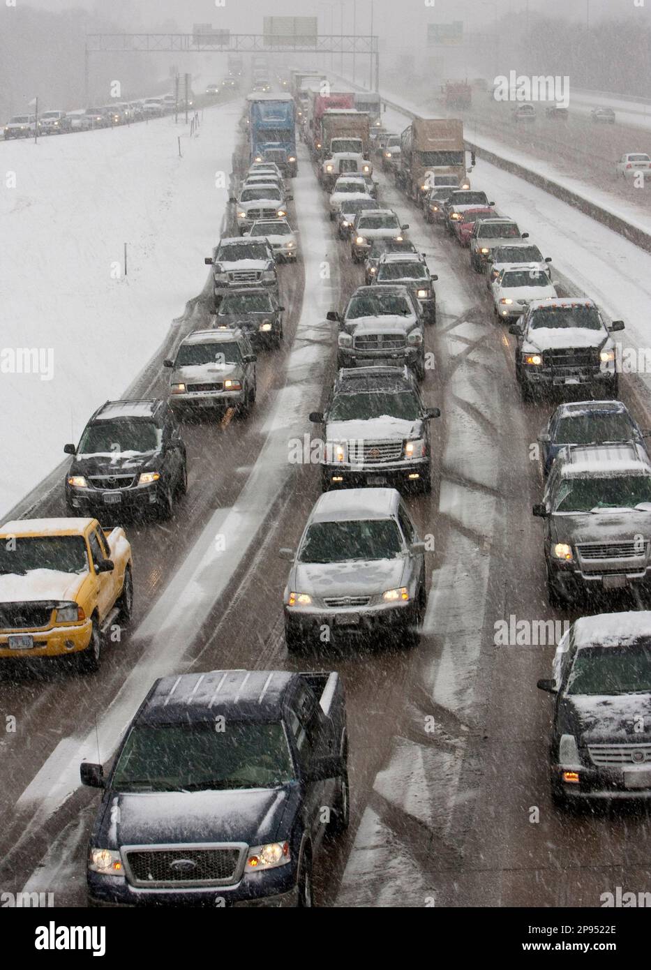 Traffic crawls on Interstate 680 in Omaha, Neb., Friday, Feb. 13, 2009 ...