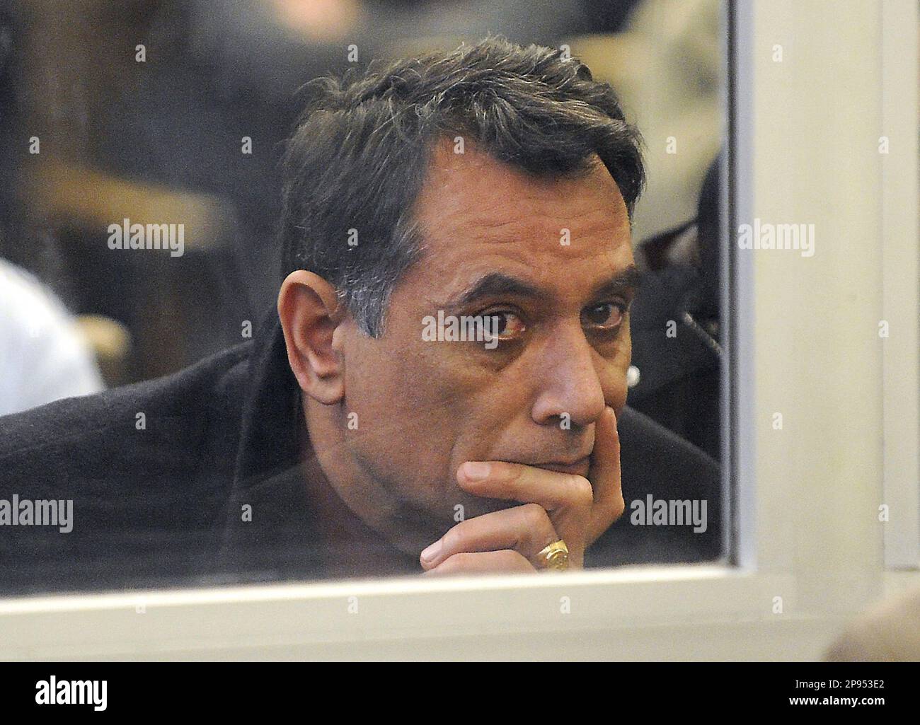 The father of Ahmad Obeidi sits in the courtroom prior to the ...