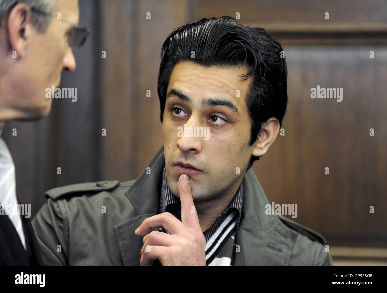 Defendant Ahmad Obeidi, right, talks to his defense lawyer Thomas ...