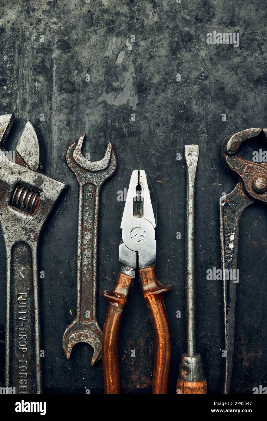 Old hardware tools. Wrench, screwdriver, measure, hammer, pliers on ...