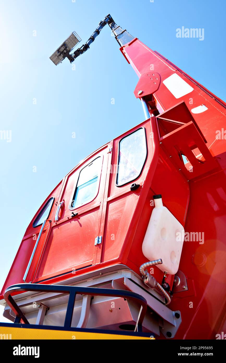 Auto hydraulic lift on sky background Stock Photo - Alamy