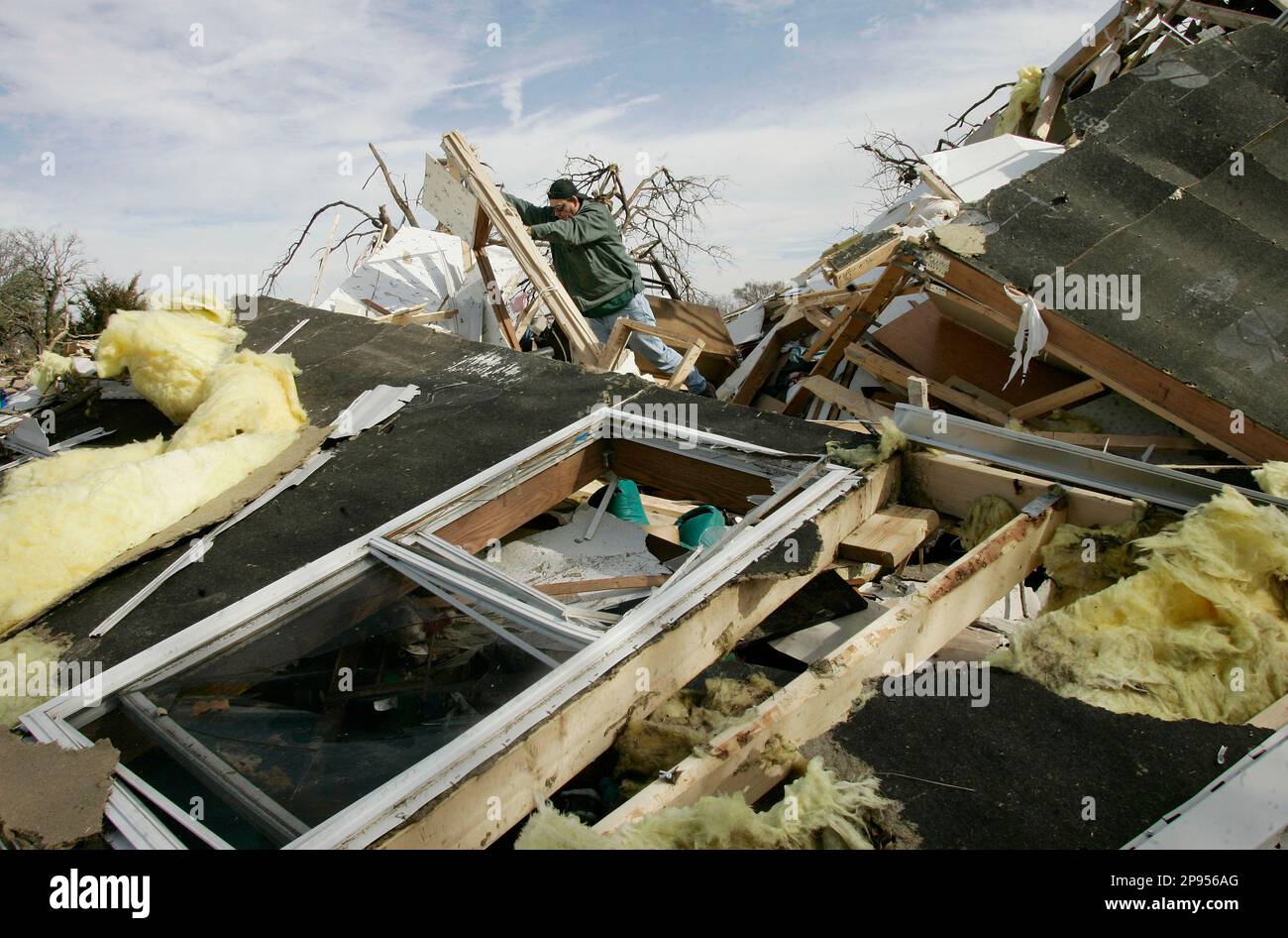 Jimmy Wyatt looks for any salvageable items in the destroyed trailer ...