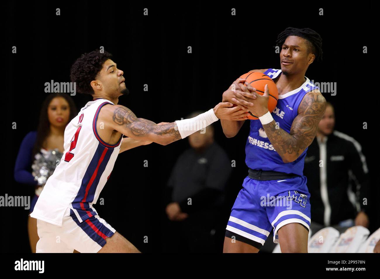 Florida Atlantic guard Nicholas Boyd, left, fouls Middle Tennessee ...