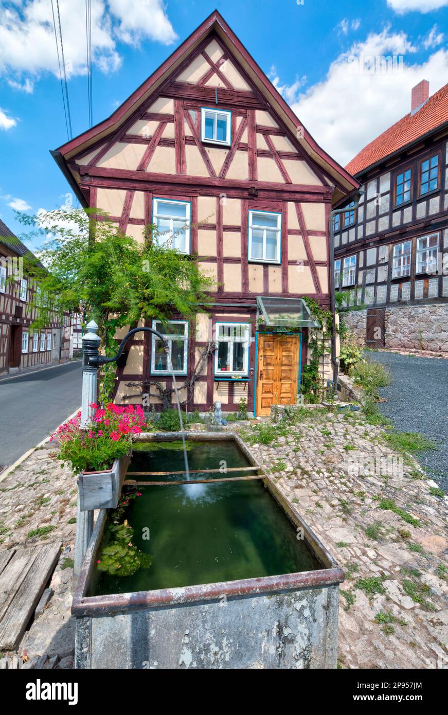 Fountain, house facade, wooden door, window, half-timbered, village ...