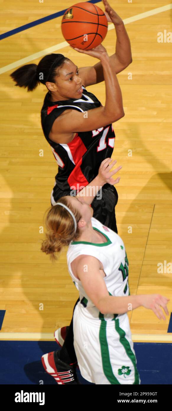 Louisville guard Candyce Bingham, top, puts up a shot over Notre Dame ...