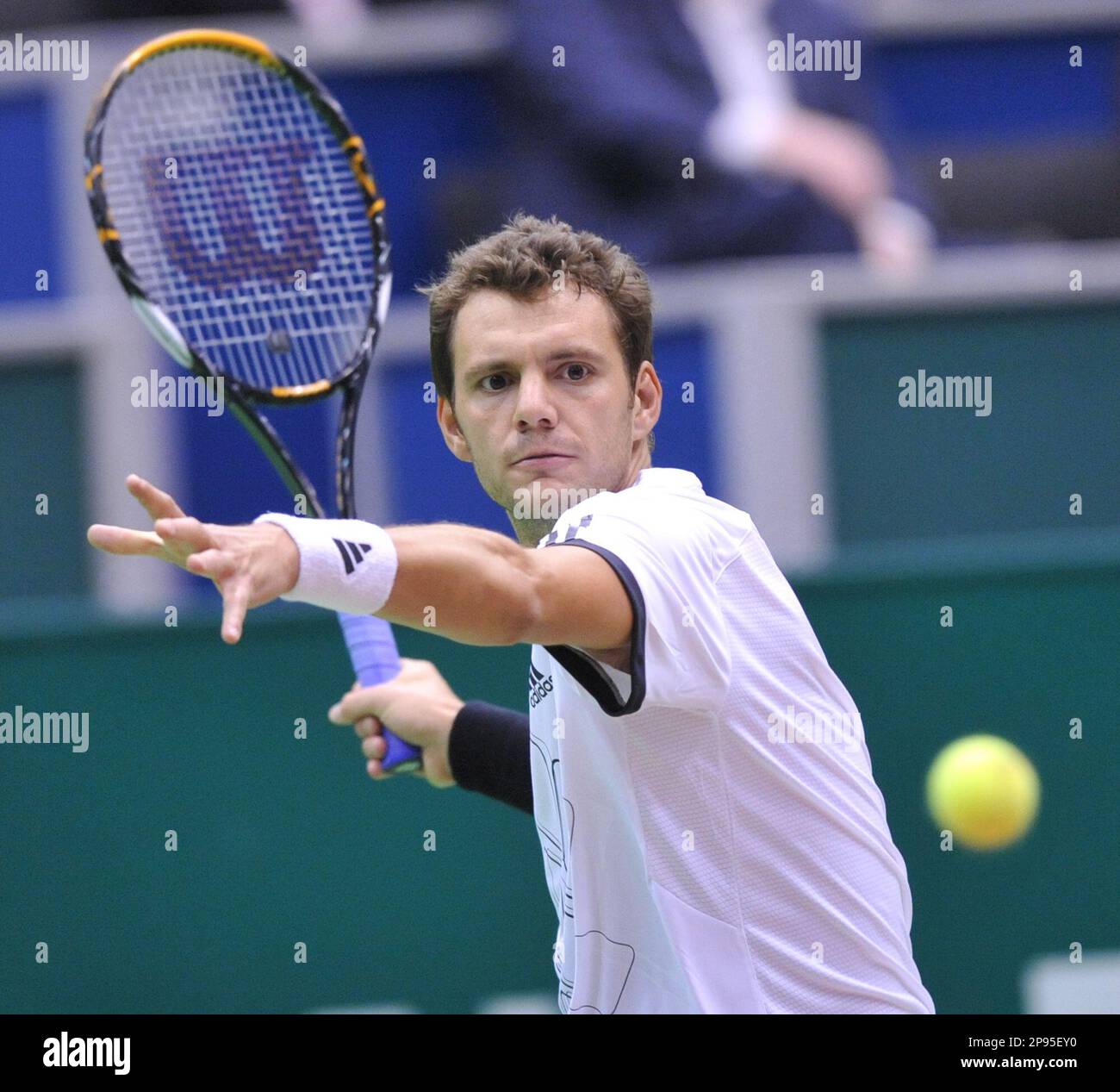 Paul-Henri Mathieu from France returns the ball to France's Richard ...