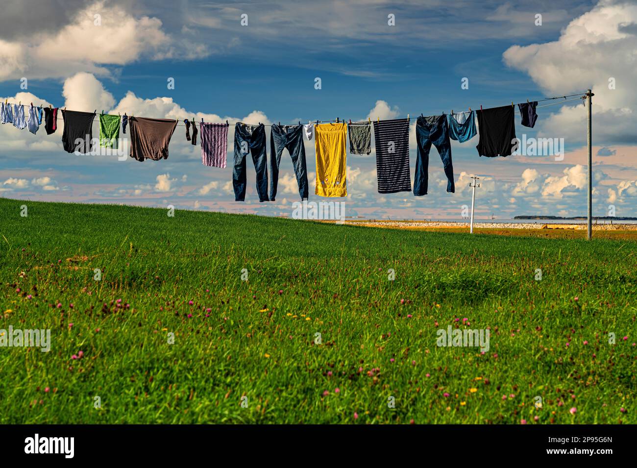 Clothes line with laundry, fresh air drying Stock Photo - Alamy