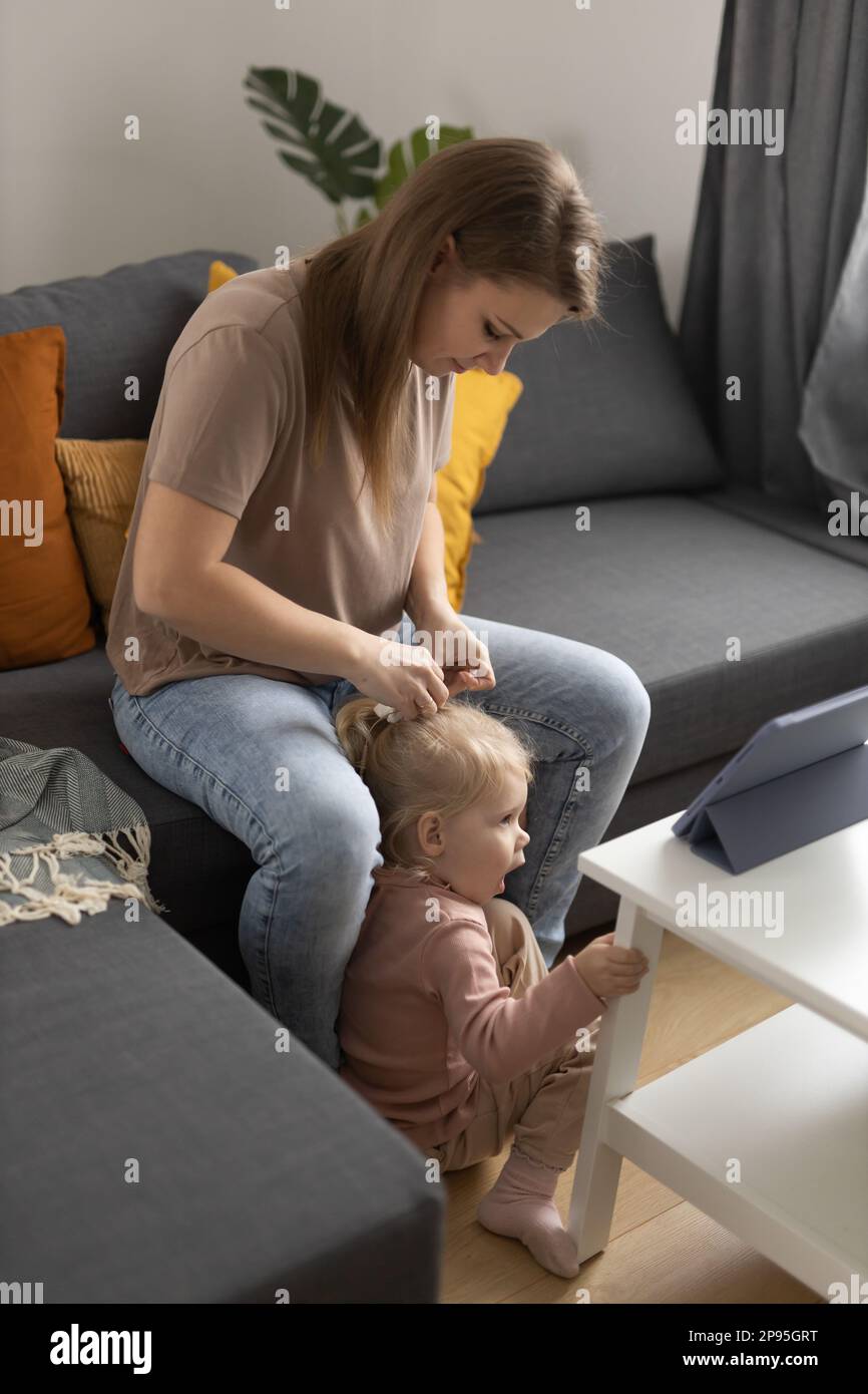 Deaf child girl with cochlear implant studying to hear sounds ...
