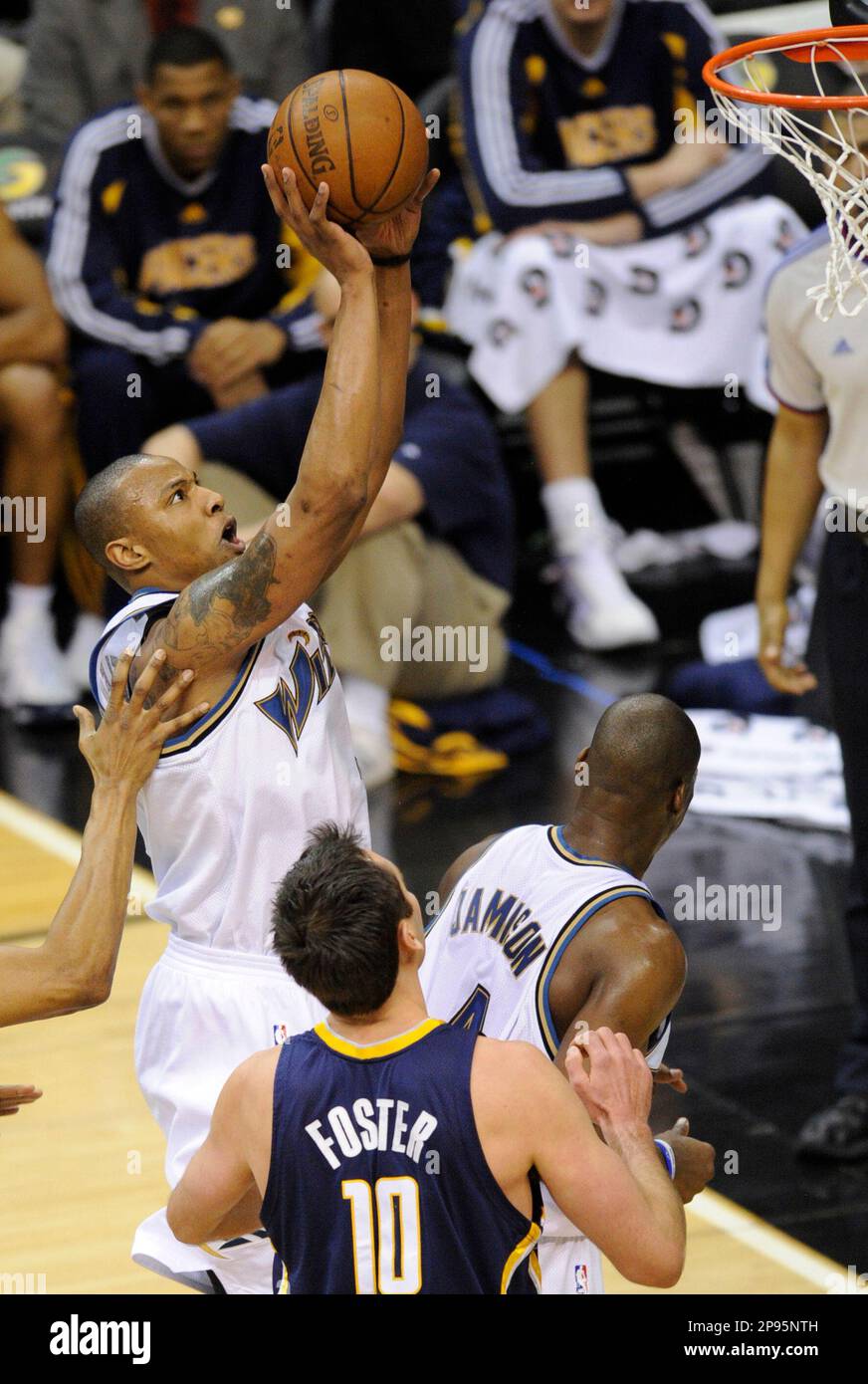 Washington Wizards' Caron Butler, left, goes to the basket against ...