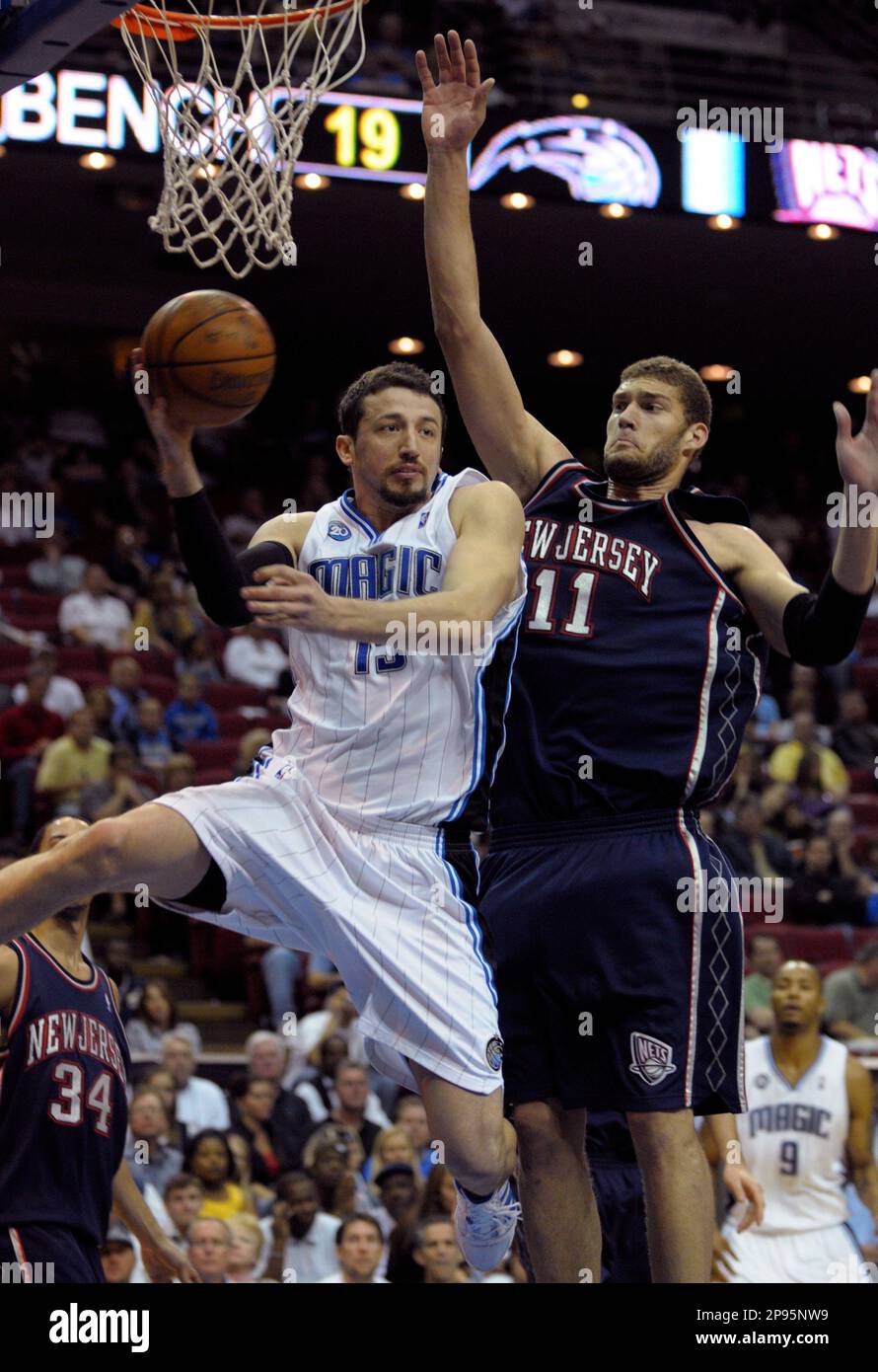 Orlando Magic forward Hedo Turkoglu, left, passes the ball to a ...
