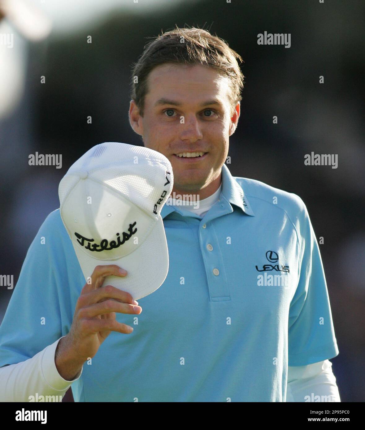 Nick Watney smiles as he tips his cap following his one shot victory at ...