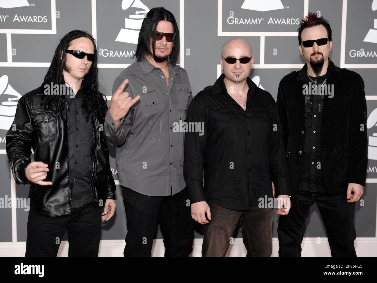 Disturbed, from left, John Moyer, Dan Donegan, David Draiman, and Mike Wengren arrive at the ...