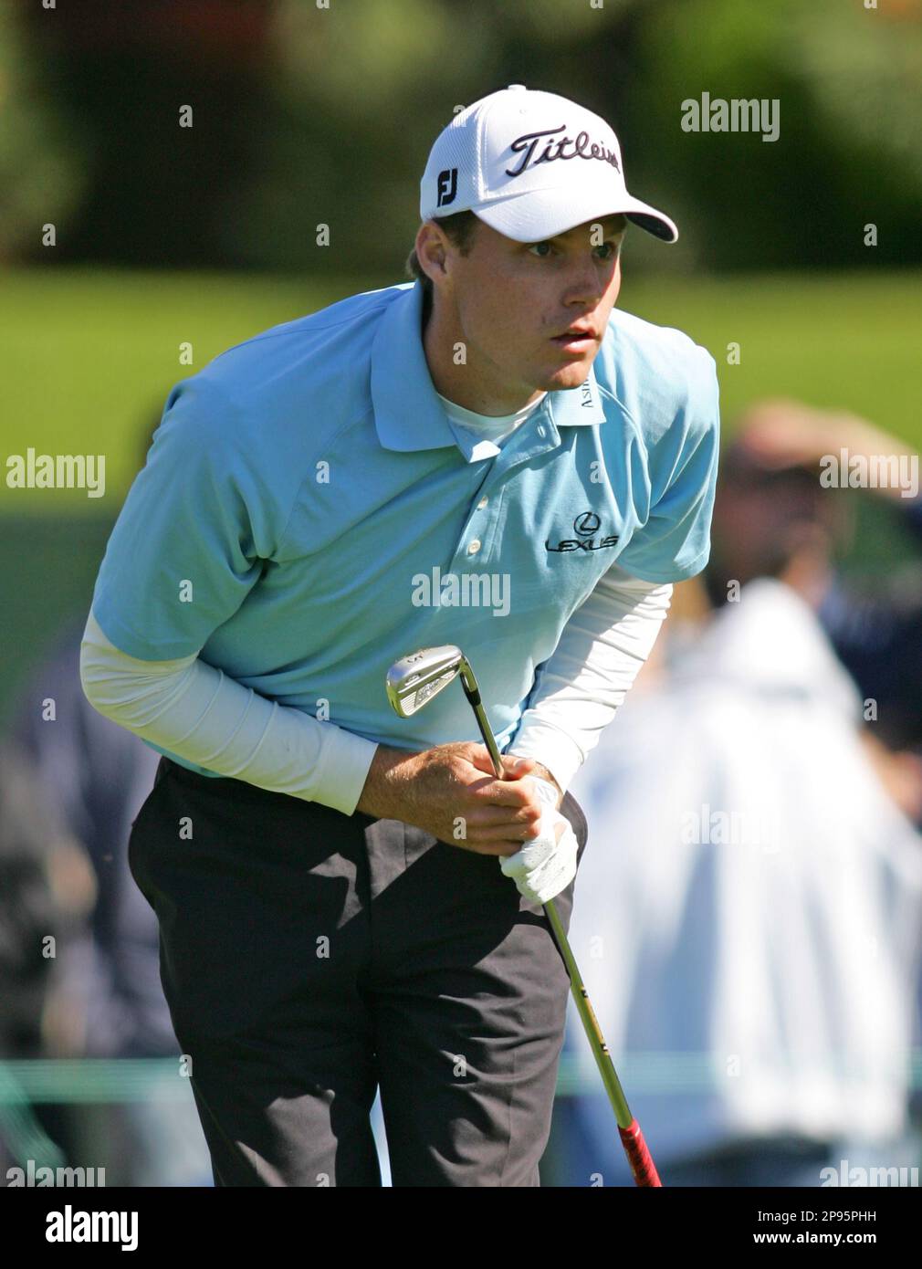 Nick Watney concentrates on his tee shot on the par three 11th hole ...