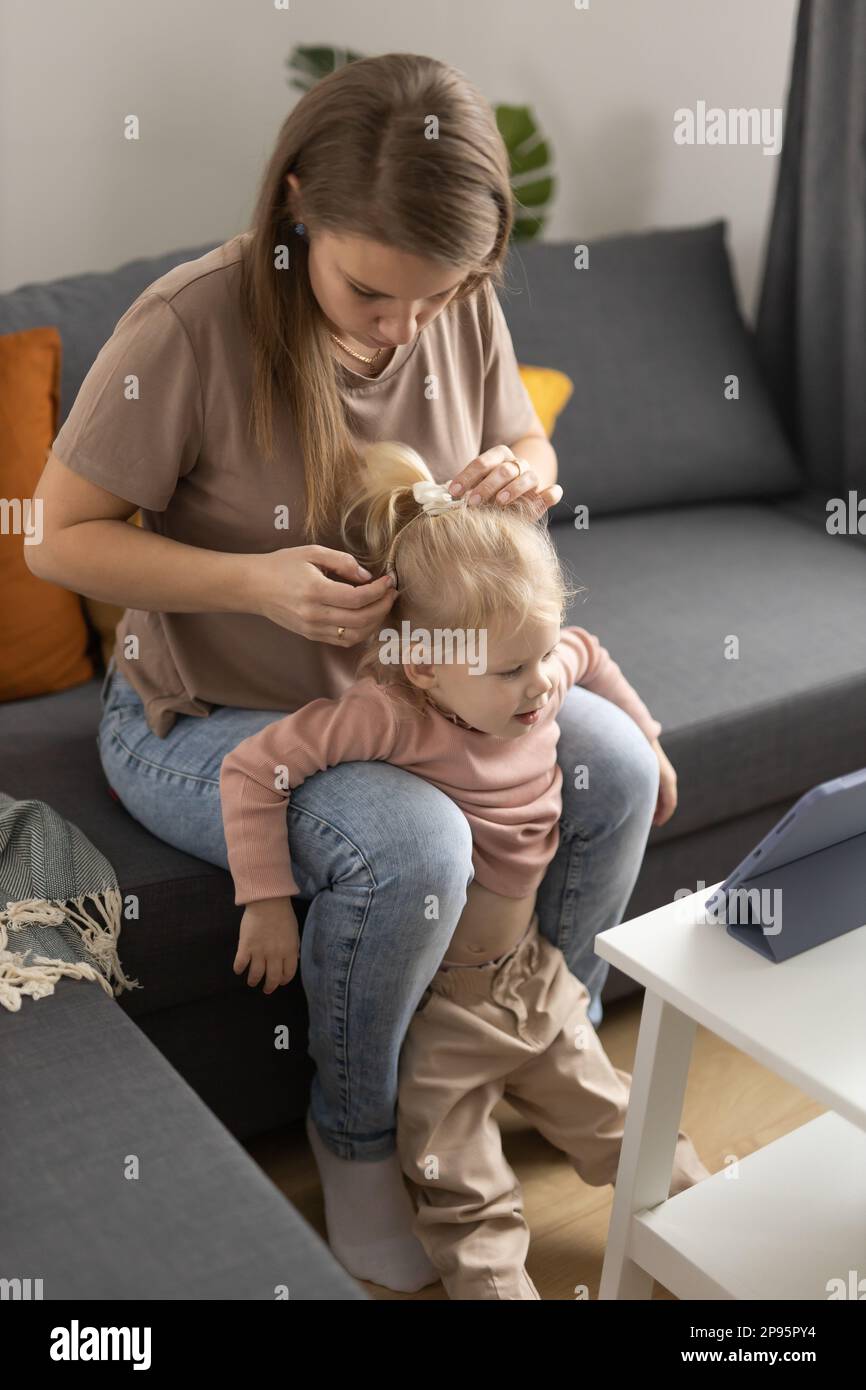 Deaf child girl with cochlear implant studying to hear sounds ...