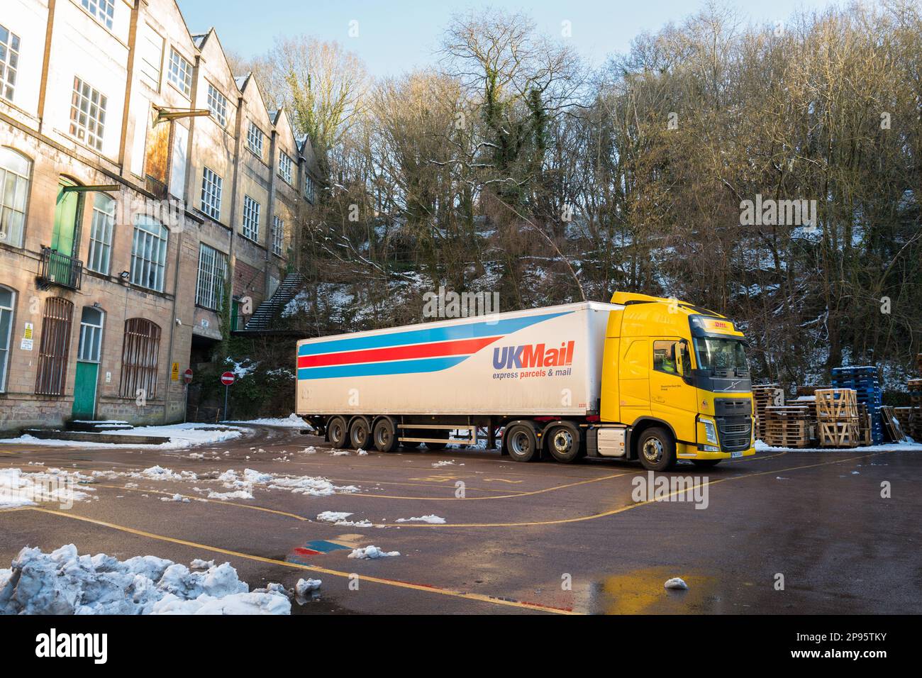 DHL hgv truck in yellow livery with UKmail trailer attached parked ...