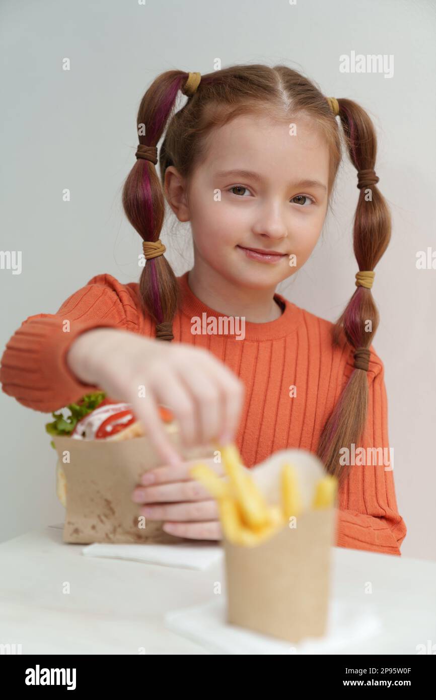 Pretty white girl eats fries and souvlaki in Greek restaurant ...