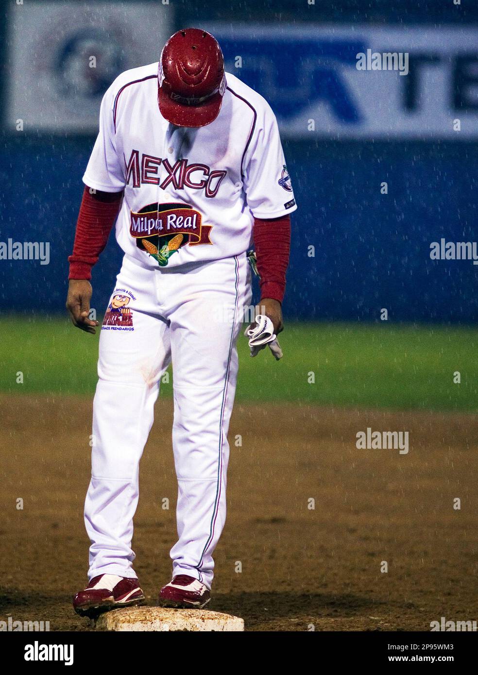 Under pouring rain, Mexico's Mazatlan Venados' Ruben Rivera stands on ...