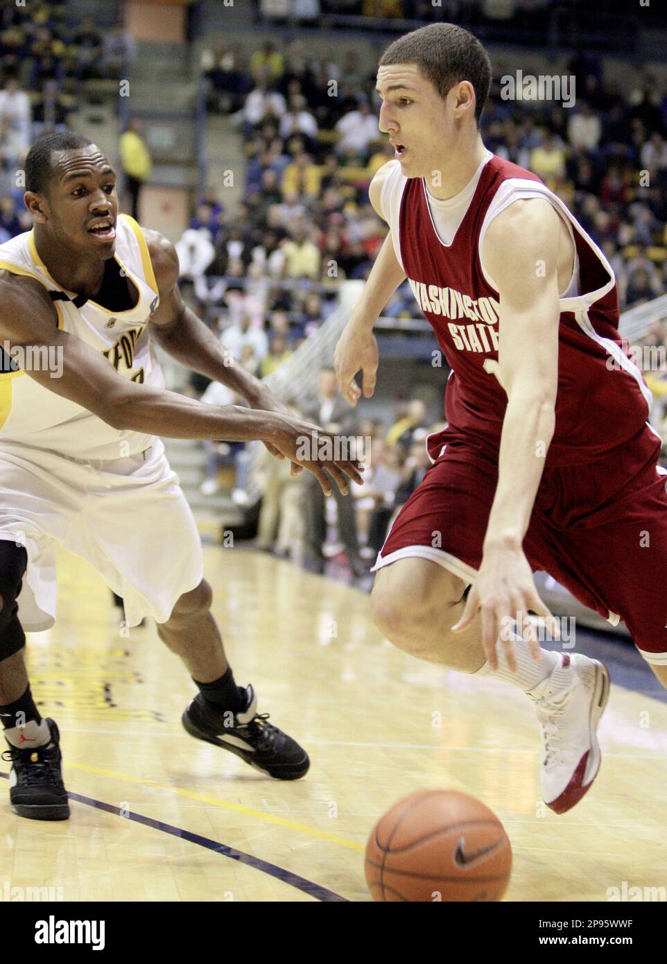 Washington State's Klay Thompson, right, drives past California's ...