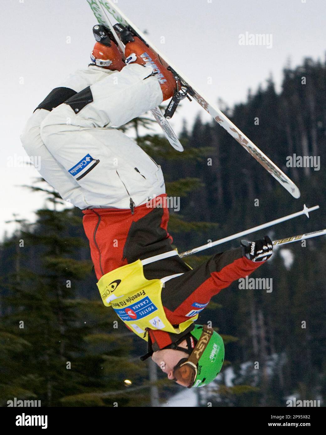 Canada's Alexandre Bilodeau makes his second jump during the moguls ...