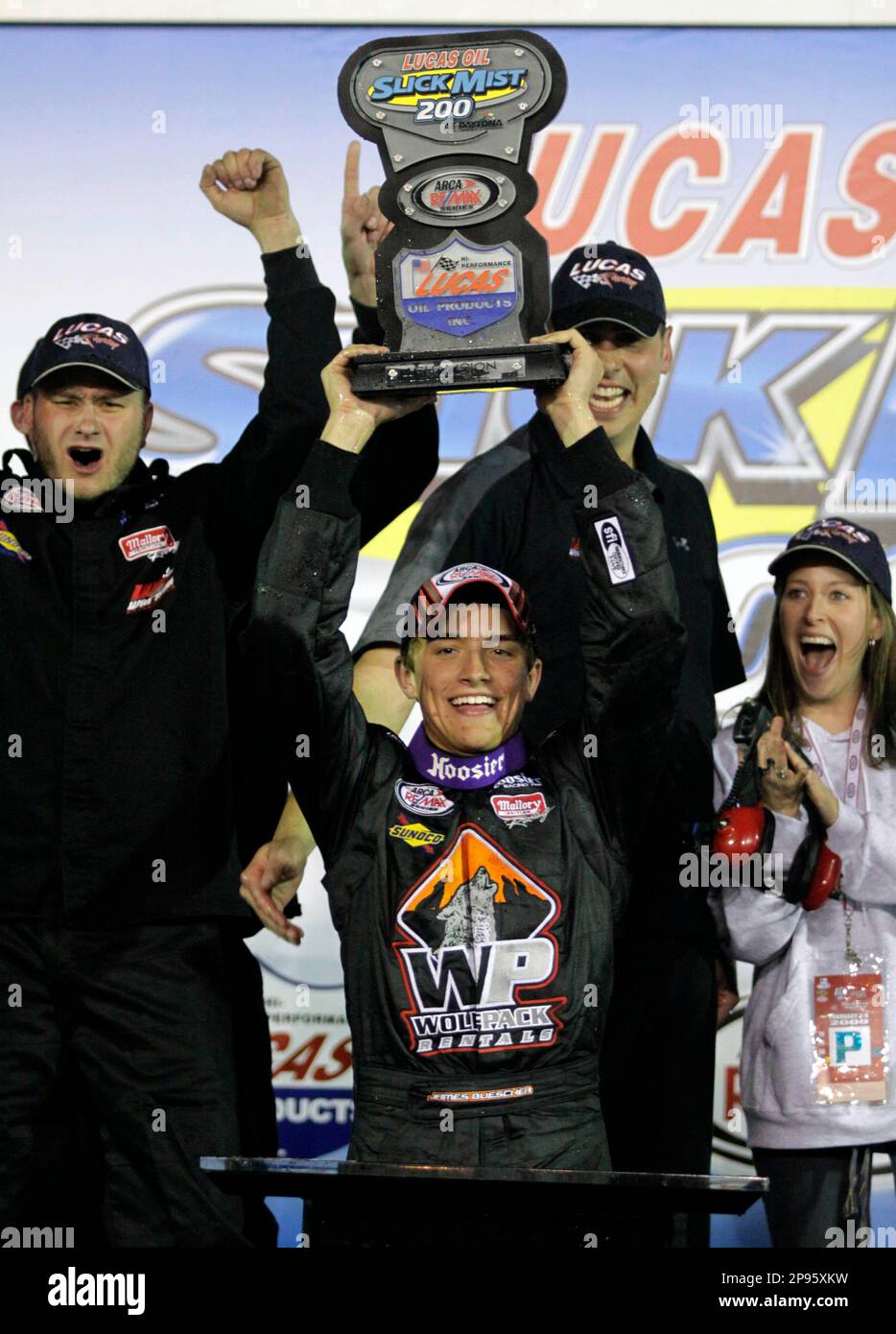 Driver James Buescher celebrates in victory lane after winning the ARCA ...