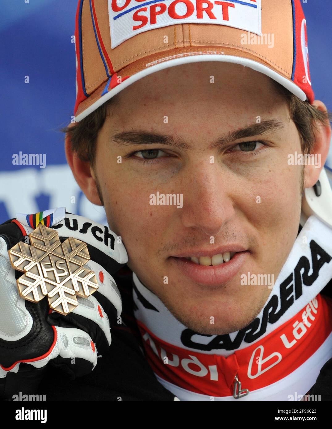 Switzerland's Carlo Janka shows the bronze medal of the Men's Downhill ...