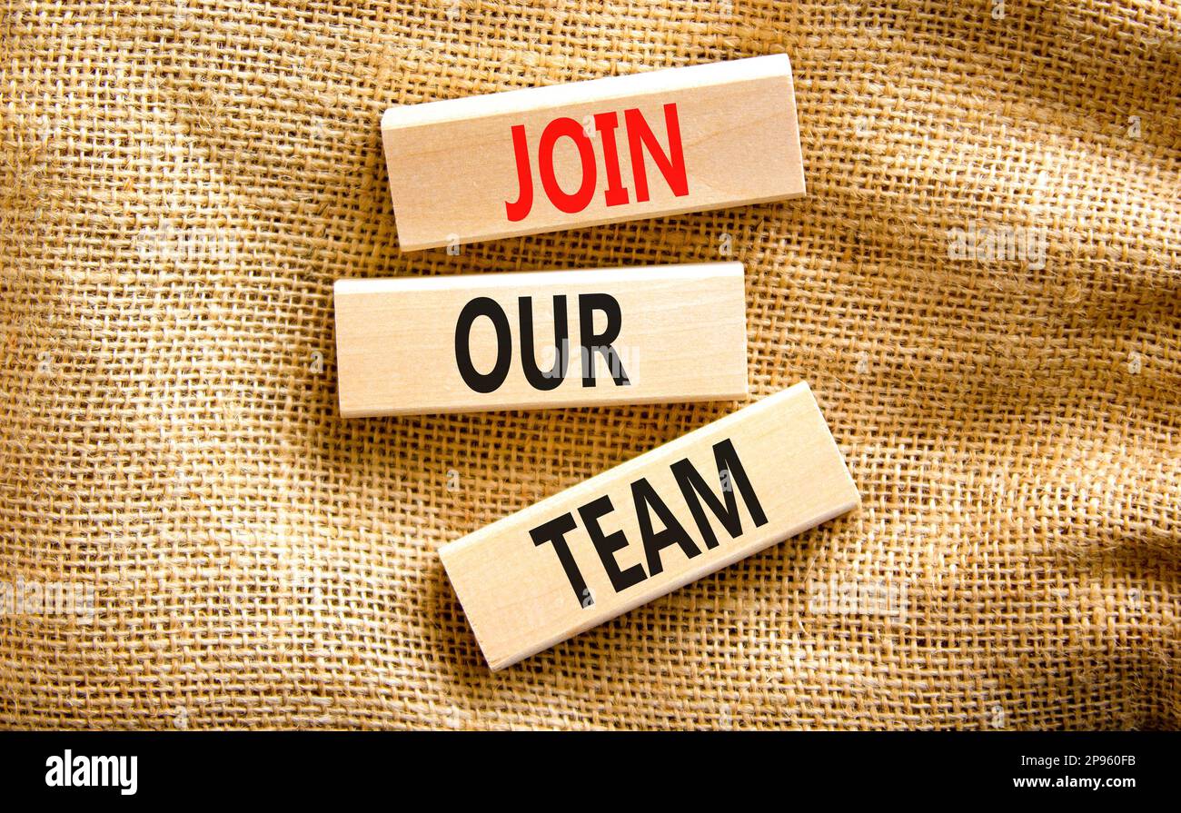 Join our team symbol. Concept words Join our team on wooden block on a beautiful canvas table ...