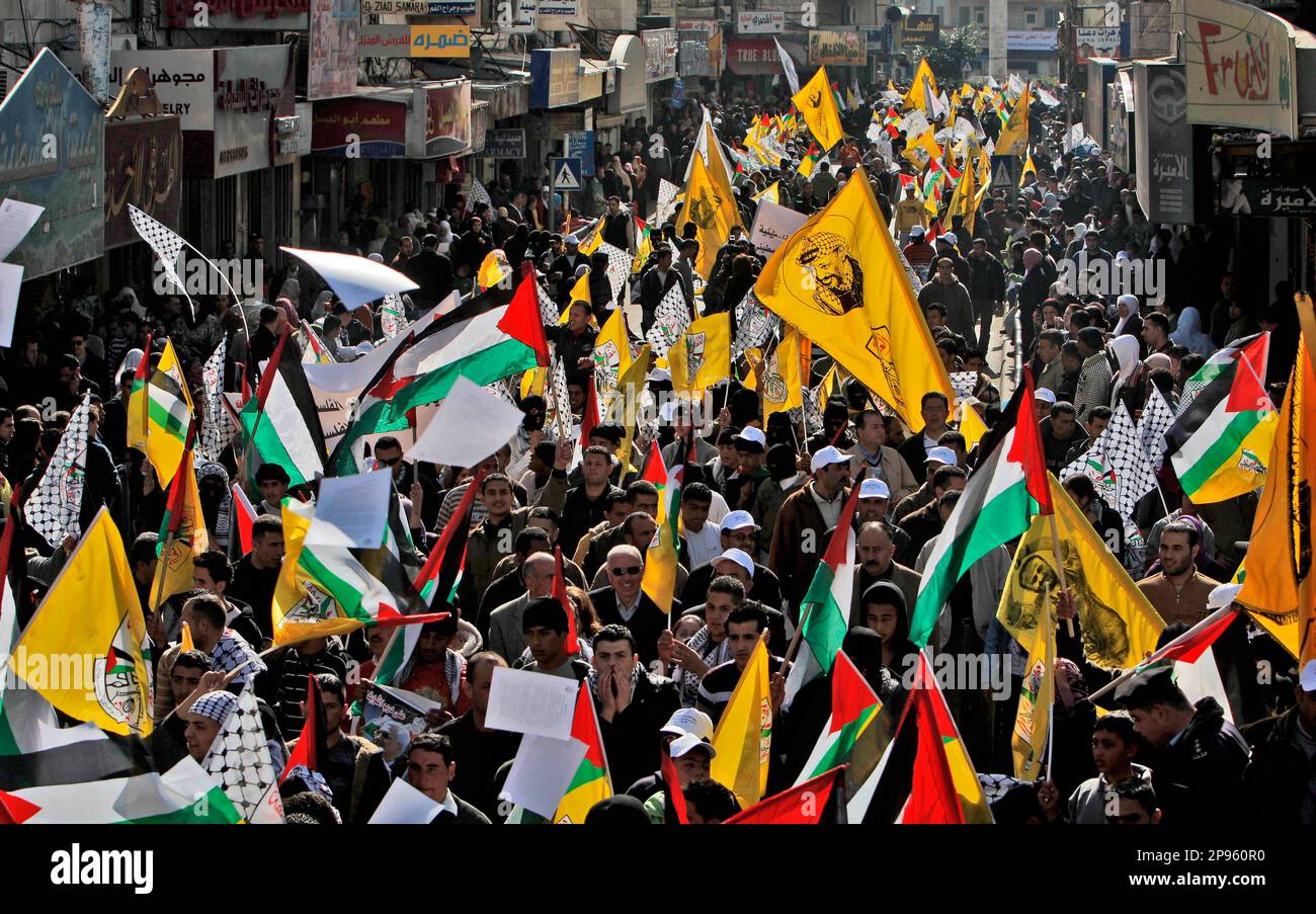 Palestinian activists and supporters of the ruling Fatah party, march ...