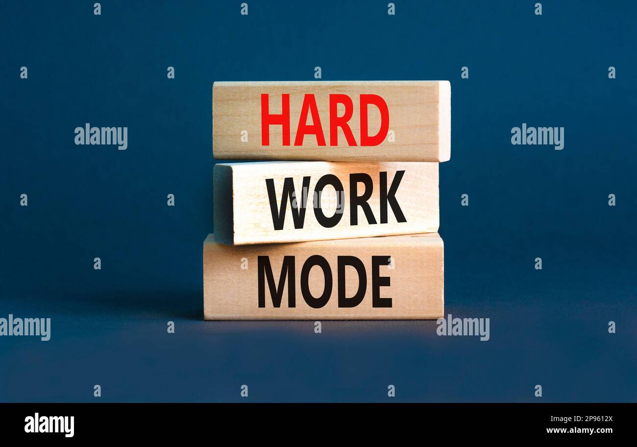 Hard work mode symbol. Concept words Hard work mode on wooden block on ...