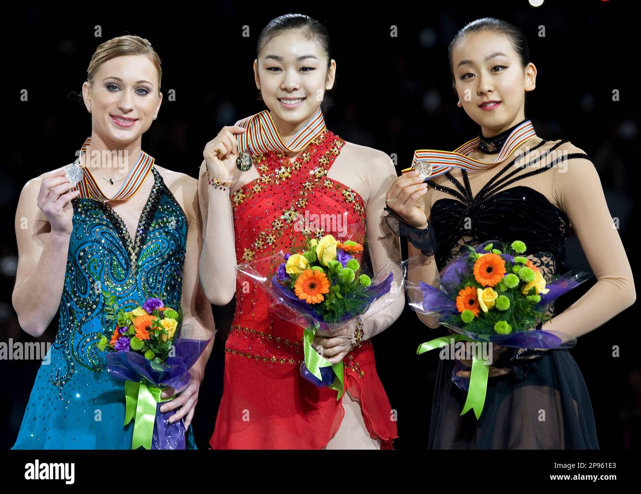 From left, silver medalist Joannie Rochette, of Canada, gold medalist ...