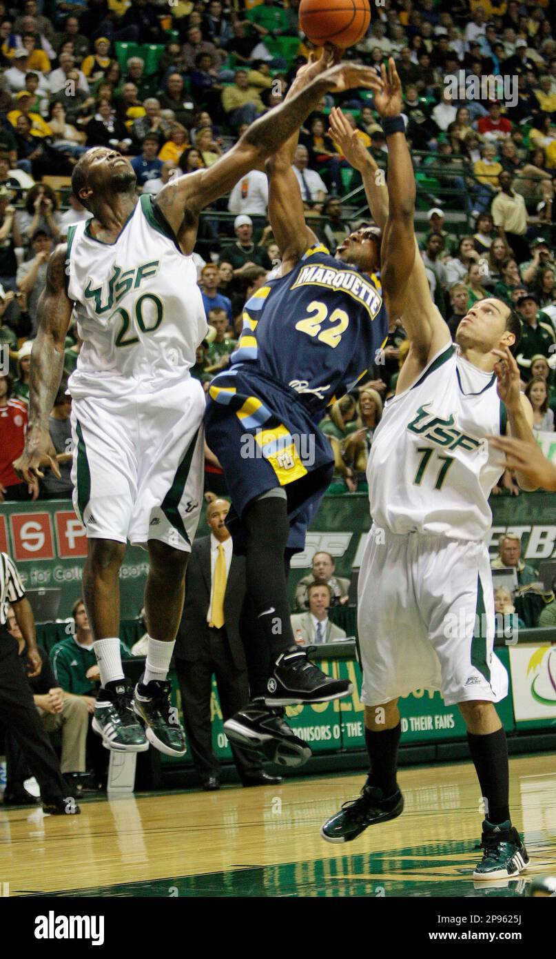 South Florida's Dominique Jones (20) and Alex Rivas (11) team up to ...