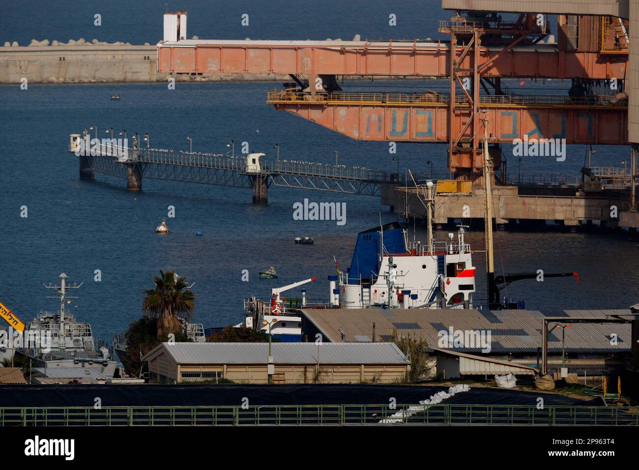 A Lebanese ship is seen docked behind a building in the southern ...