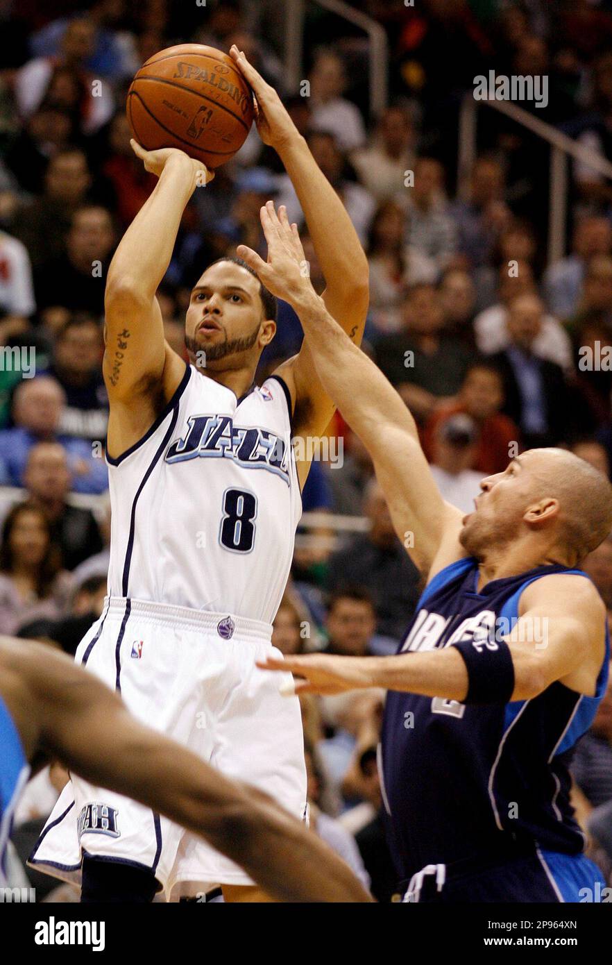 Utah Jazz guard Deron Williams (8) puts a shot over the defensive arm ...