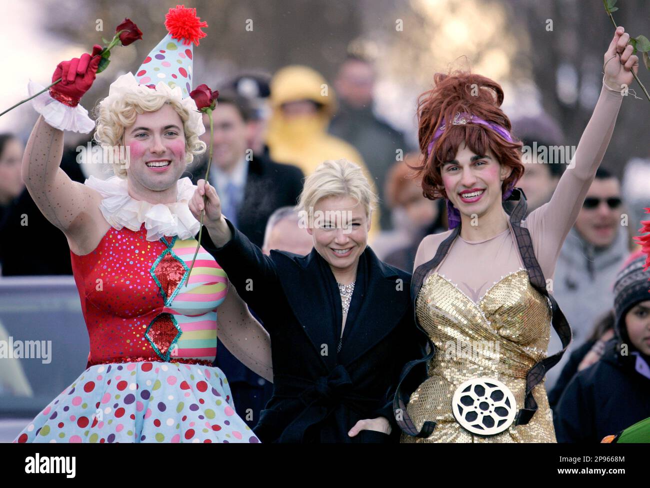 Actress Renee Zellweger, center, flanked by Hasty Pudding Theatricals ...