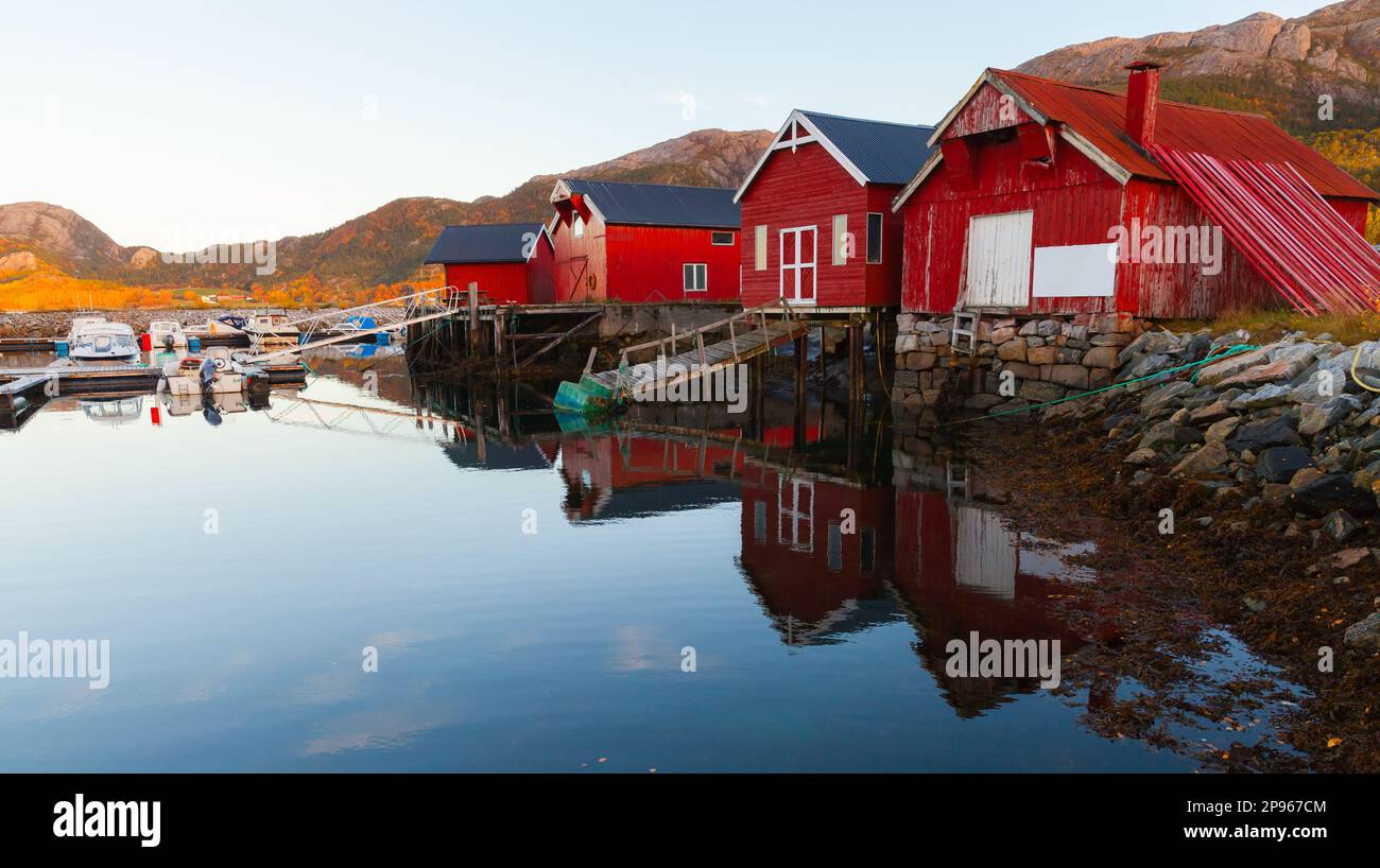 Norwegian landscape photo with traditional old red wooden barns ...
