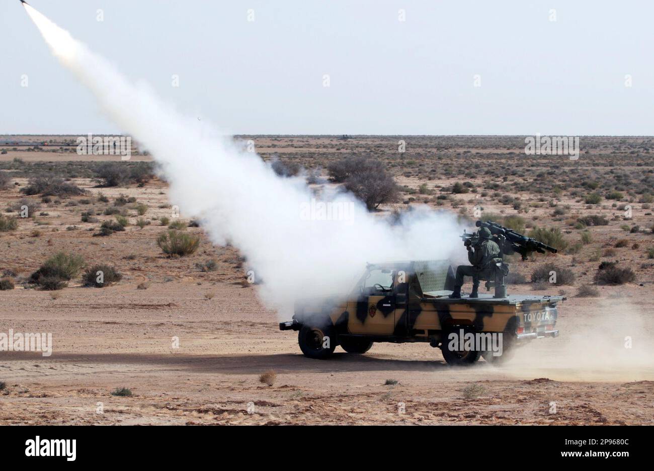 A Libyan army vehicle fires an anti aircraft missile during army ...