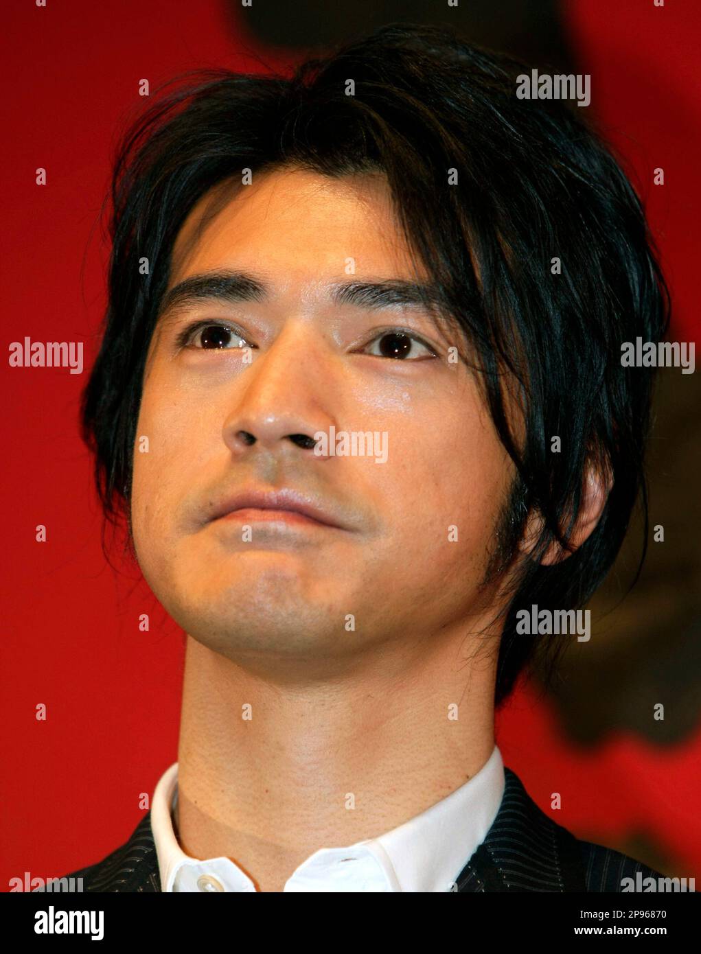 Taiwan-born Japanese actor Takeshi Kaneshiro pose for photographers ...