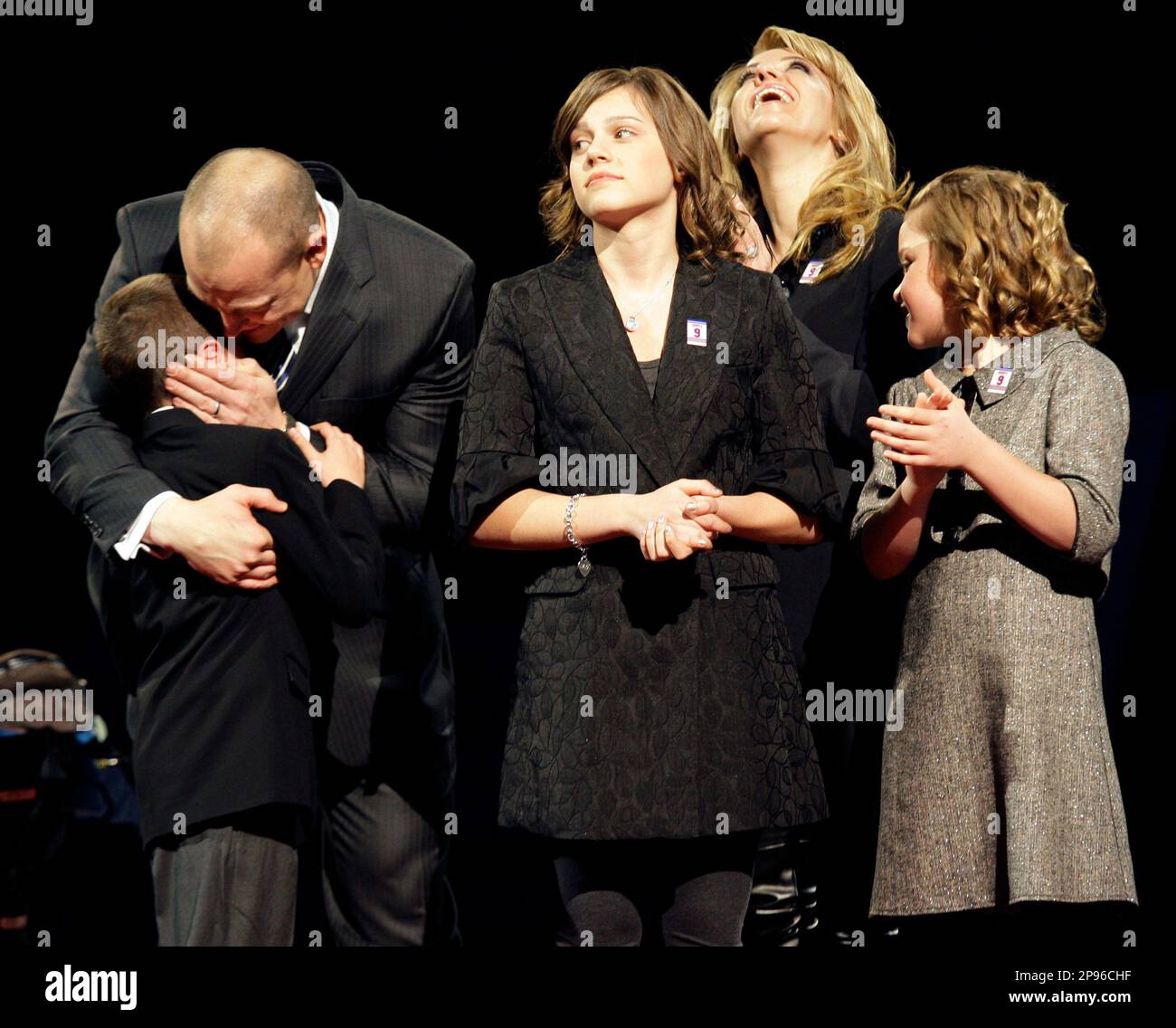 Former New York Rangers' Adam Graves, left, embraces his son Logan as ...
