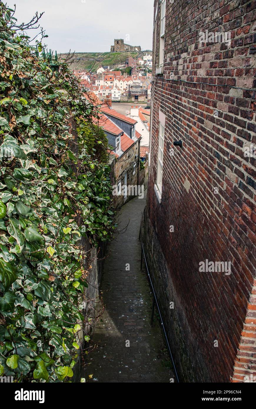 An alley in Whitby North Yorkshire that heads in the direction of the ...
