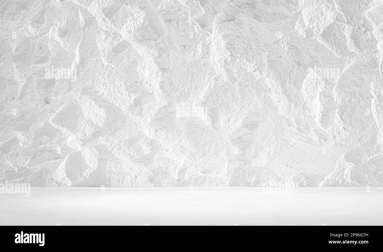 White Smooth Stone Table and Textured White Stone Wall Stock Photo - Alamy